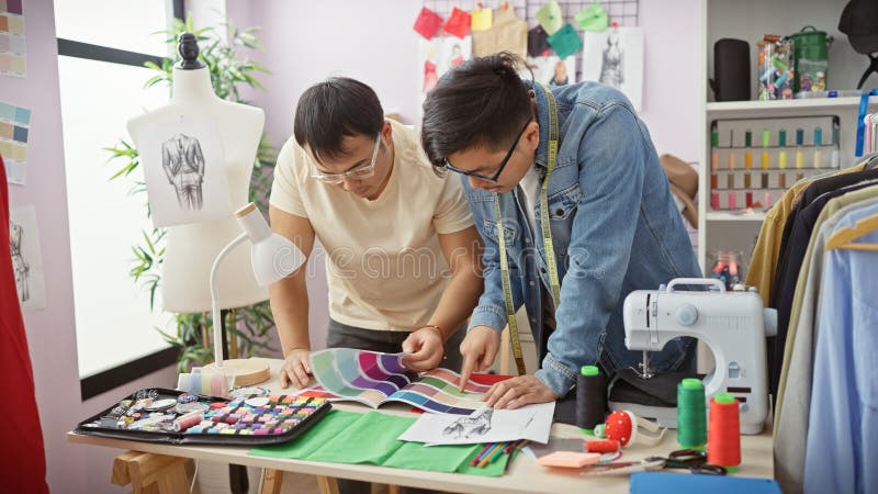 Two Men Collaborating in a Tailor Shop, Selecting Fabrics for a Garment ...