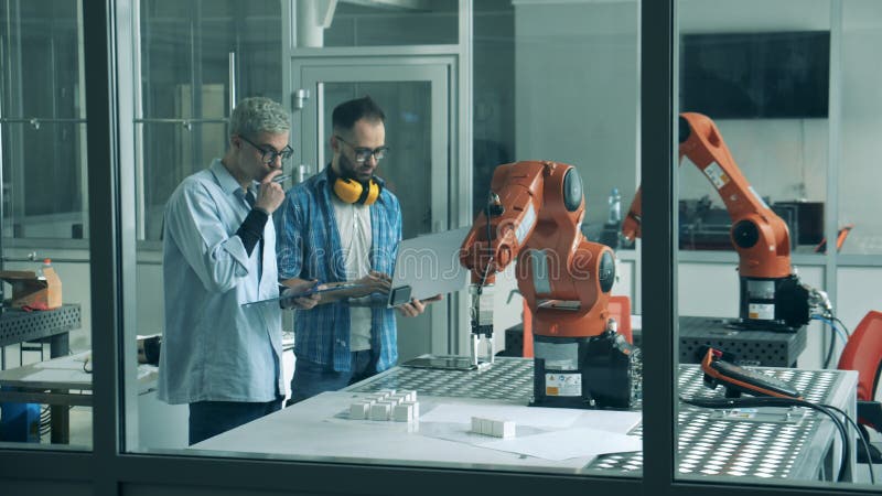 Group of Students, Young Engineers Testing Robot. Laboratory with ...