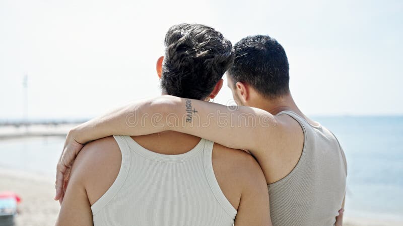 Two Men Couple Hugging Each Other Backwards at Seaside Stock Photo ...