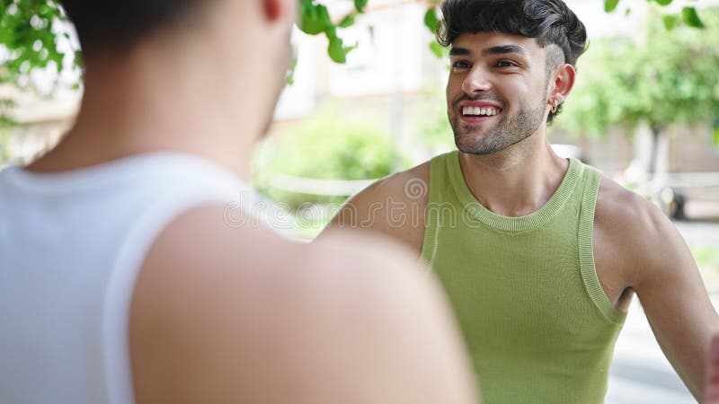 Two Men Couple Smiling Confident Speaking at Park Stock Photo - Image ...