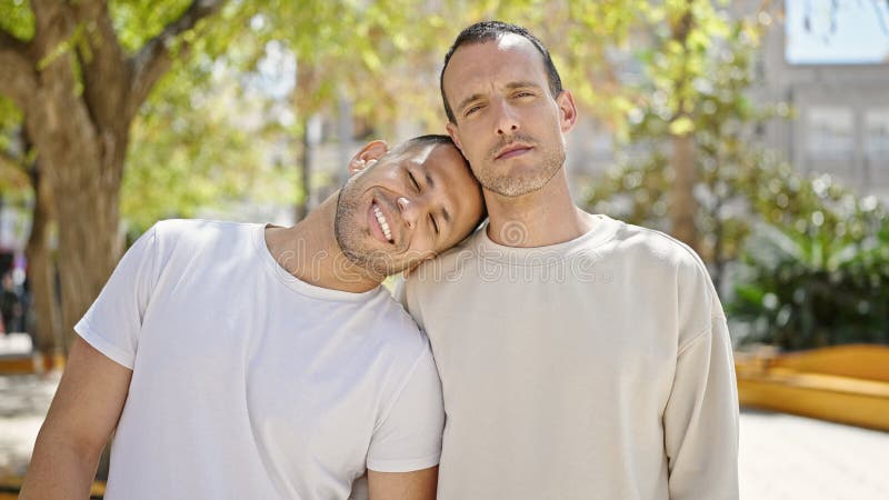 Two Men Couple Smiling Confident Standing Together at Park Stock Photo ...