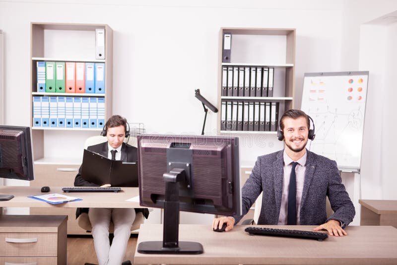 Two Men from Customer Service Support Working in the Office Stock Photo ...