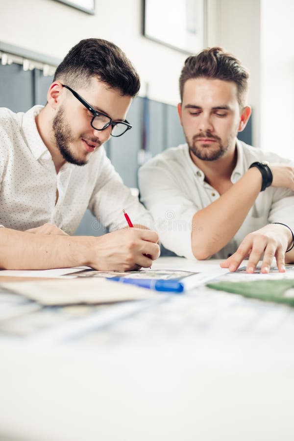 Two Men Designers Looking at Plans Stock Image - Image of collaboration ...