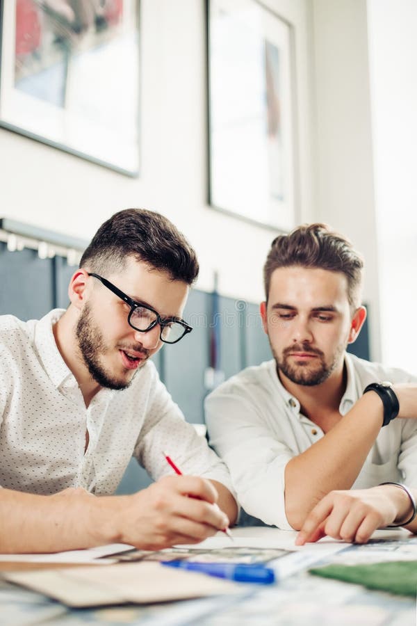 Two Men Designers Looking at Plans Stock Photo - Image of building ...