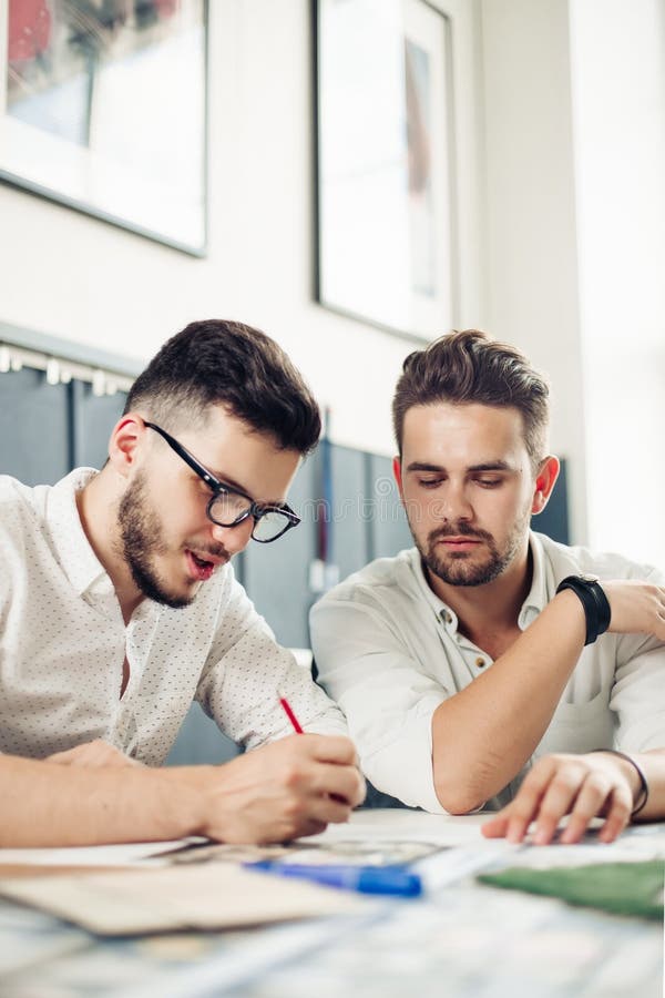 Two Men Designers Looking at Plans Stock Image - Image of glasses ...