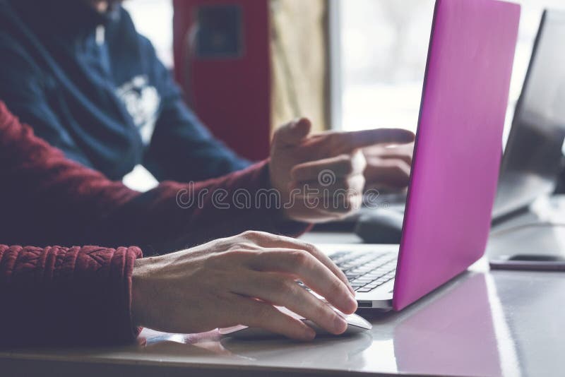 Two Men Developers Working On Modern Laptops Developing Programming And Coding Technologies