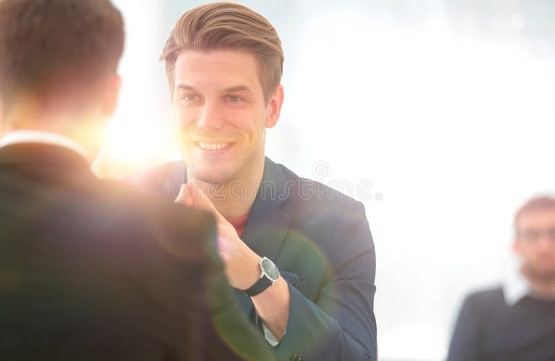 Two Men Discuss the Growth of the Company, Looking at the Rising Graph ...