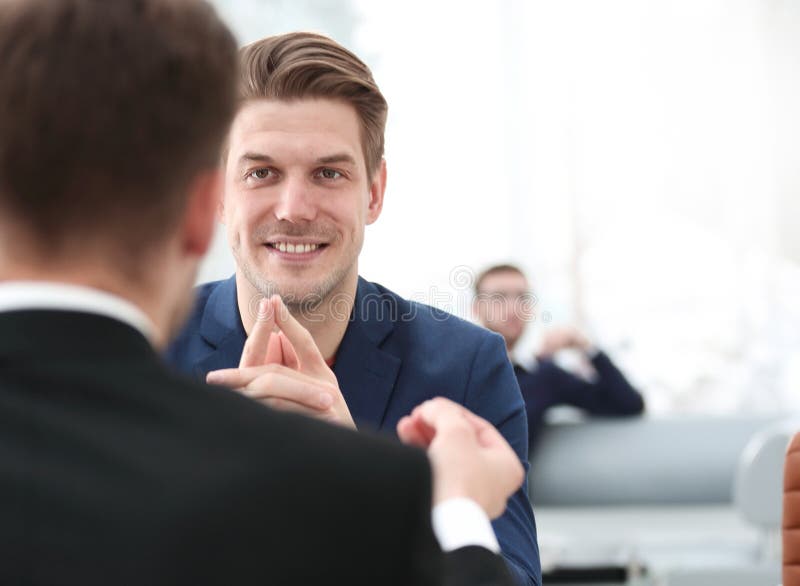Two Men Discuss the Growth of the Company, Looking at the Rising Graph ...