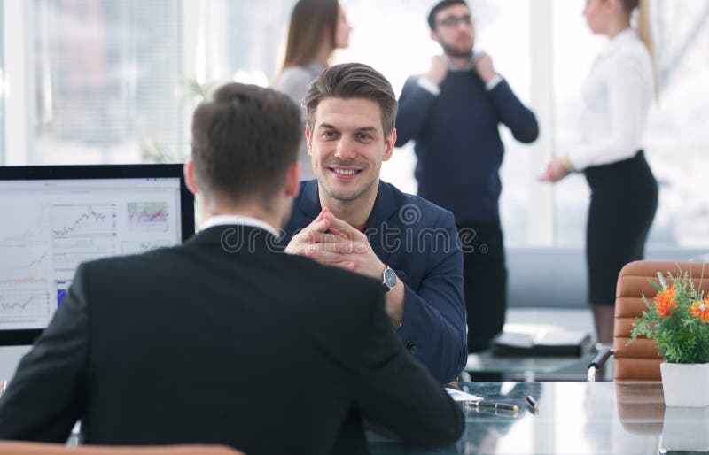 Two Men Discuss the Growth of the Company, Looking at the Rising Graph ...