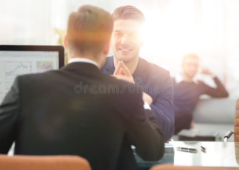 Two Men Discuss the Growth of the Company, Looking at the Rising Graph ...