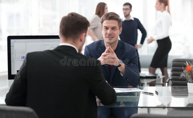 Two Men Discuss the Growth of the Company, Looking at the Rising Graph ...