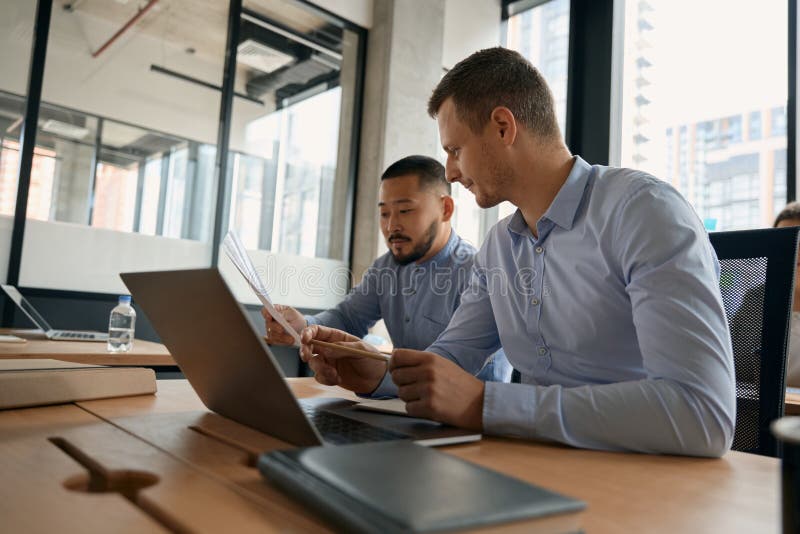 Two Men are Discussing Documents in Hands, Being in Office Stock Photo ...