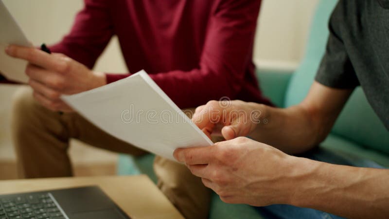 Two Men are Discussing and Looking through Documents Stock Photo ...