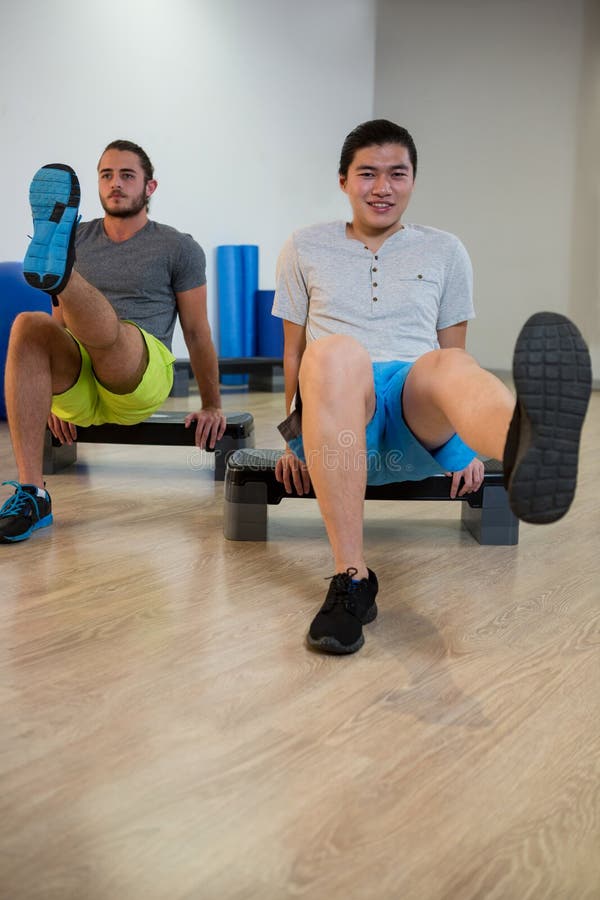 Two Men Doing Aerobic Exercise on Stepper Stock Image - Image of health ...
