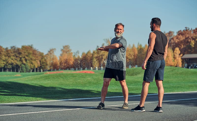 The Two Men Doing Exercise Outdoor. Stock Photo - Image of retirement ...