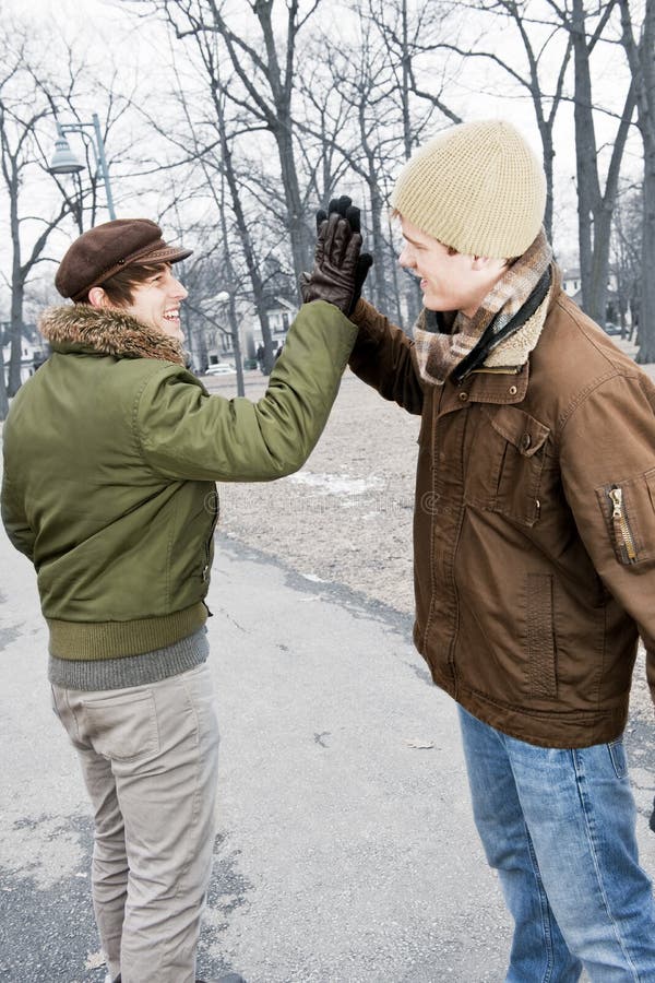 Two Men Doing High Five in Park Stock Photo - Image of five, friendship ...