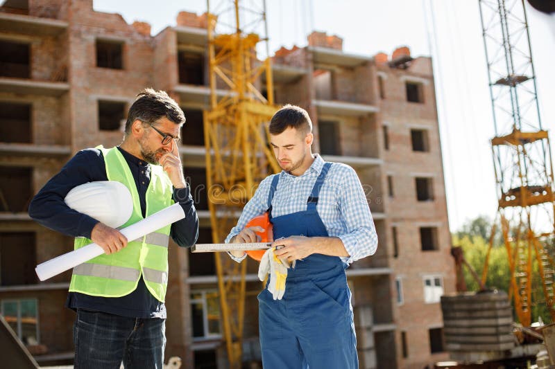 Two Men Engineers at a Construction Site are Talking Stock Image ...