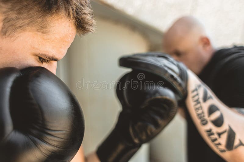 Two Men Exercising and Fighting in Outside. Boxer in Gloves is Training ...