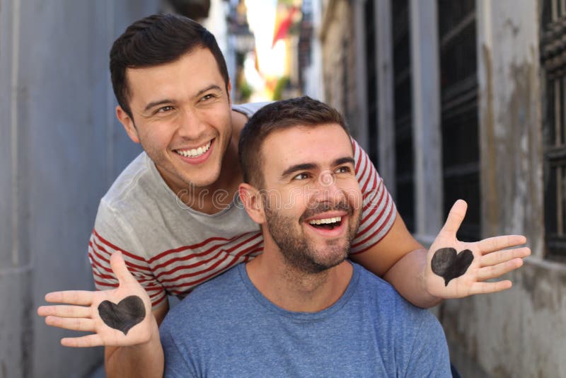 Two men falling in love stock photo. Image of holding - 186403800