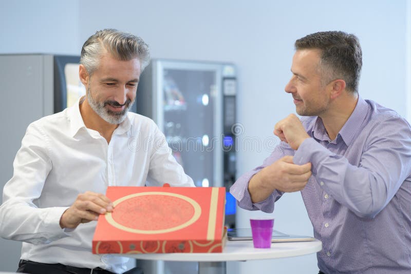Two Men Friends Eating Pizza during Break at Work Stock Photo - Image ...