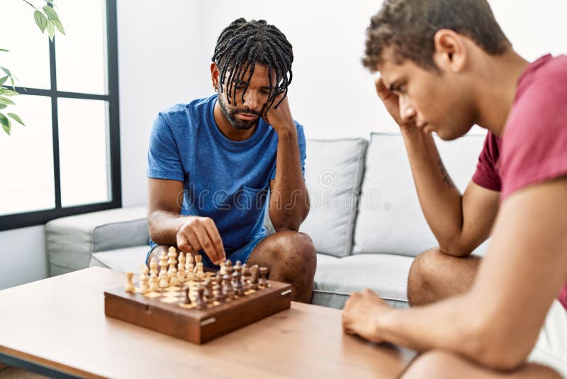 Two Men Friends Playing Chess Sitting on Sofa at Home Stock Photo ...