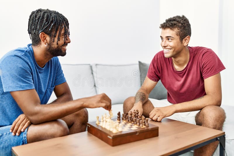 Two Men Friends Playing Chess Sitting on Sofa at Home Stock Photo ...