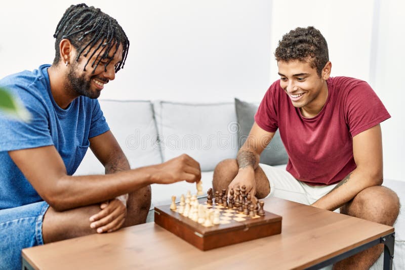Two Men Friends Playing Chess Sitting on Sofa at Home Stock Photo ...