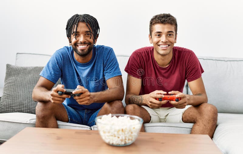 Two Men Friends Playing Video Game Sitting on Sofa at Home Stock Image ...