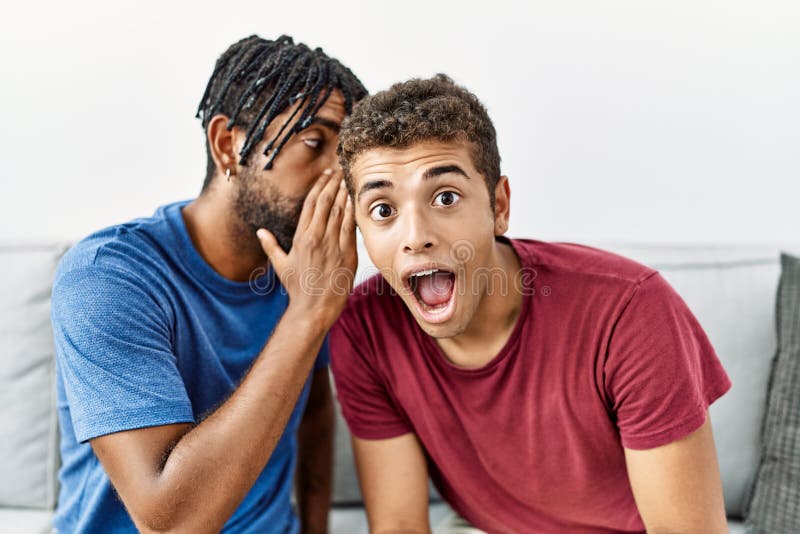 Two Men Friends Whispering Secret Sitting on Sofa at Home Stock Photo ...