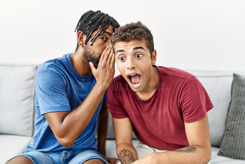 Two Men Friends Whispering Secret Sitting on Sofa at Home Stock Photo ...
