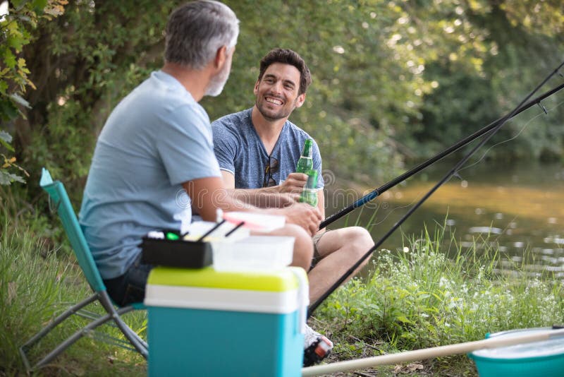 Two Men Having Beer while Fishing Stock Photo - Image of coolbox ...