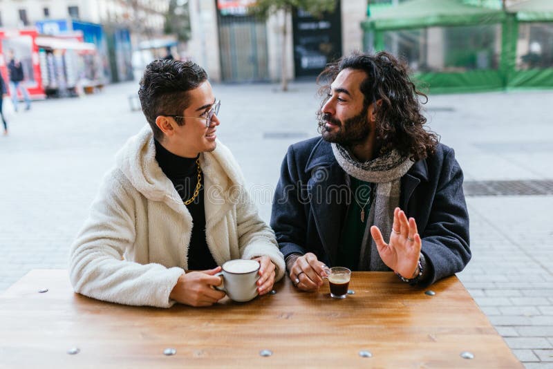 Two Men Having Coffee Together Outdoors at Coffee Shop. Stock Photo ...