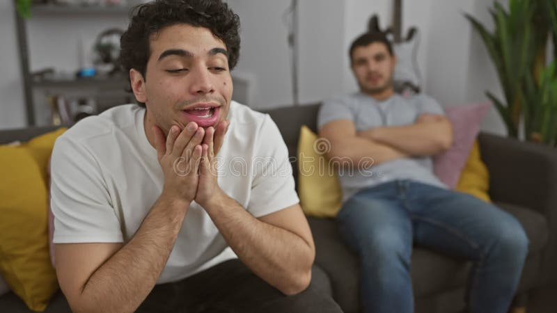 Two Men Having a Conversation Indoors, with One Expressing Surprise and ...
