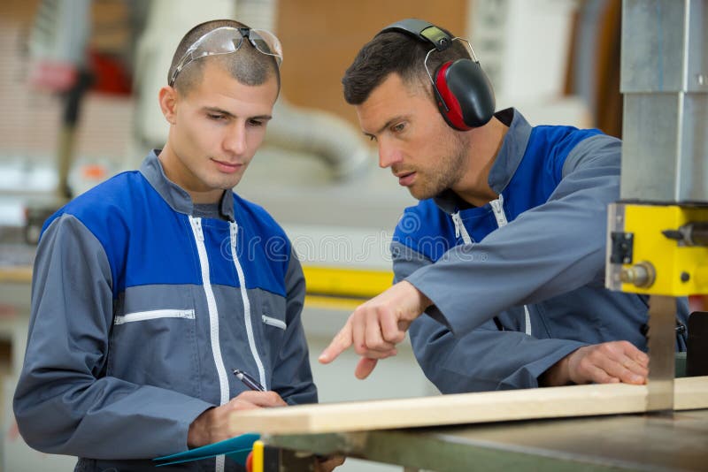 Two Men Having Conversation in Wood Workshop Stock Image - Image of ...