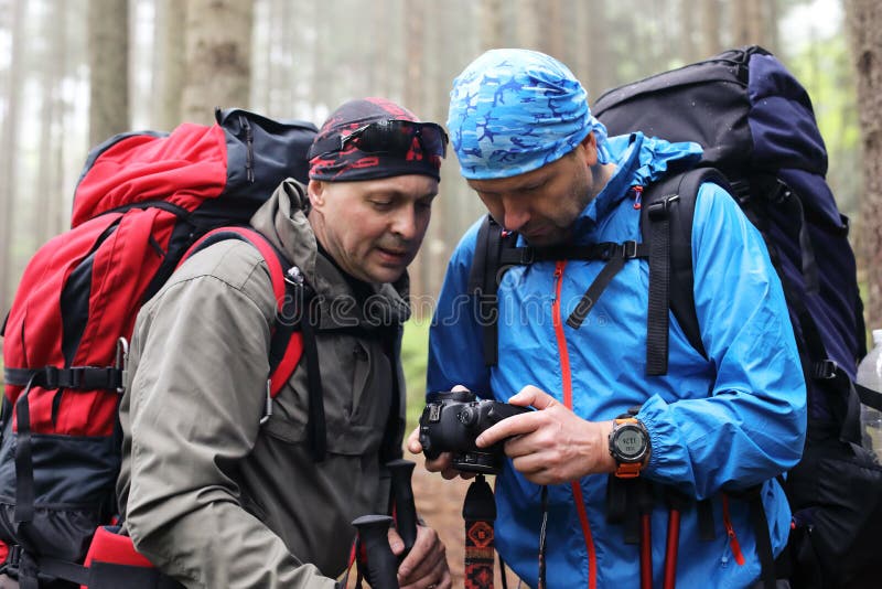 Two Men Hike in Forest with Backpack for Trekking Stock Photo - Image ...