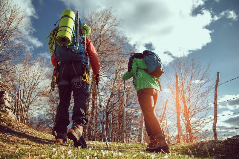 Two men hiking. stock photo. Image of guide, landscape - 109625644