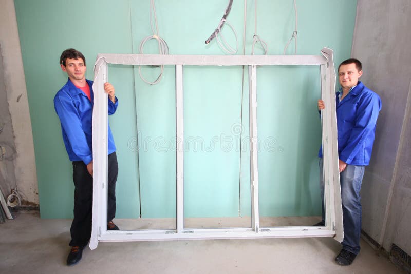 Two men holding new window stock image. Image of human - 315395245