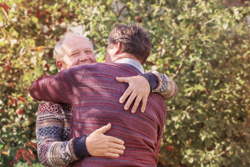 Two Men Hugging in Autumn Park Stock Image - Image of caucasian, close ...
