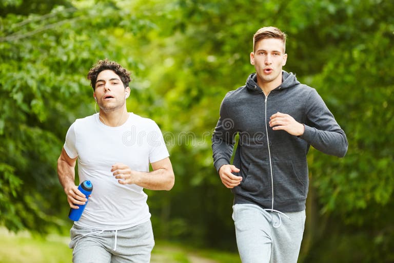 Two Men Jogging at the Park Stock Photo - Image of people, outside ...
