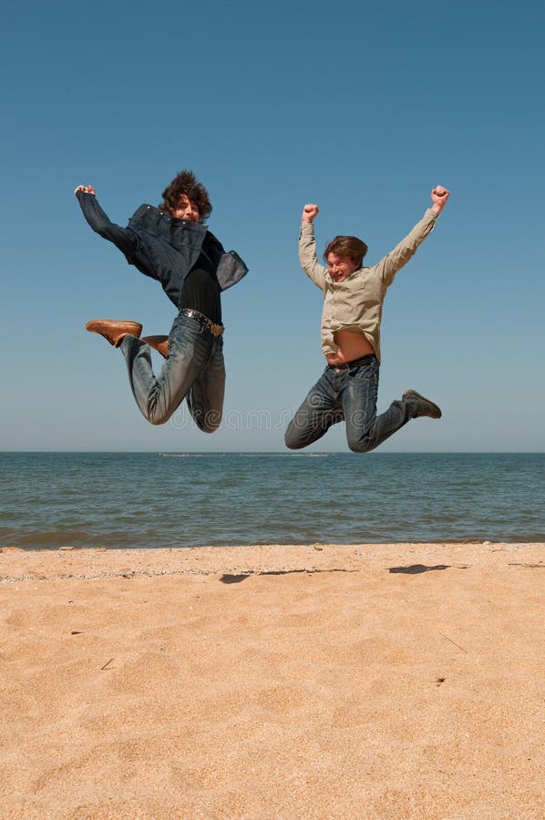 Two men in a jump. stock image. Image of coast, entertainment - 14968671
