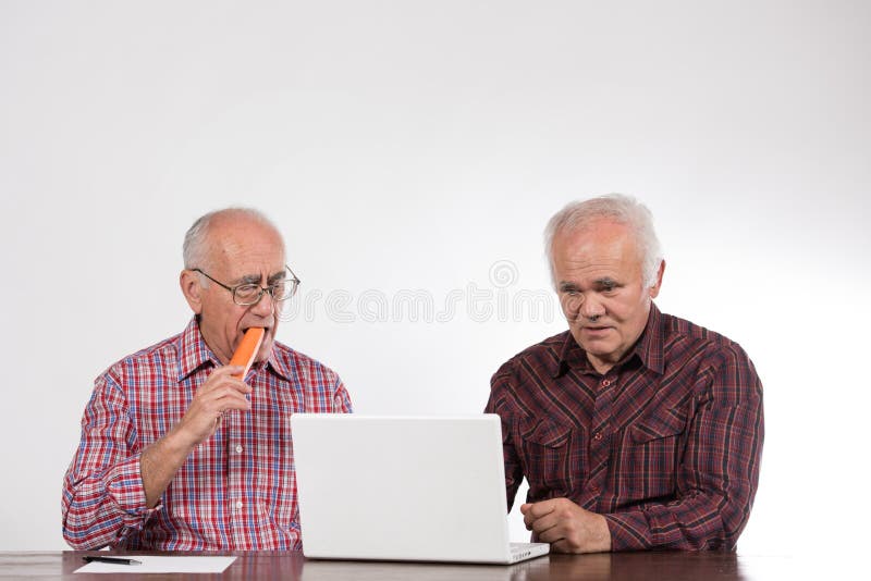 Two men work with laptop stock image. Image of computer - 133950189