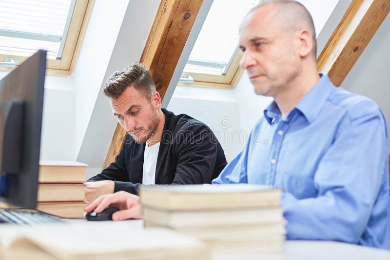 Two Men Learn at the Computer in the Training Stock Photo - Image of ...