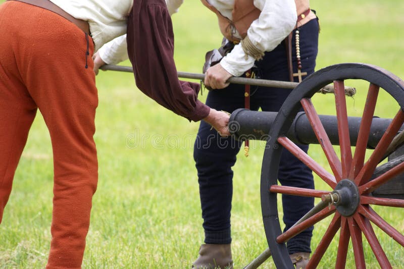 Two men loading a cannon stock image. Image of cannon, charging - 212081
