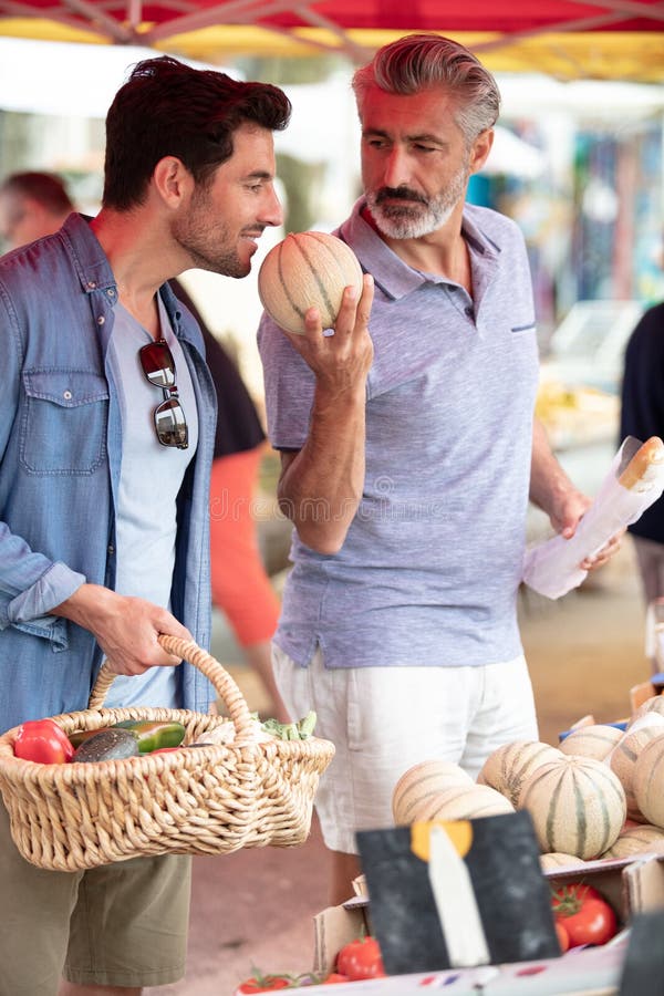 Two Men in Local Market Choosing Melon Stock Photo - Image of family ...