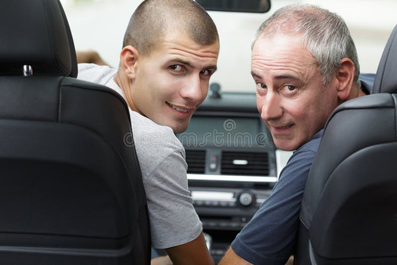Two Men Looking Back and Smiling Stock Image - Image of people ...