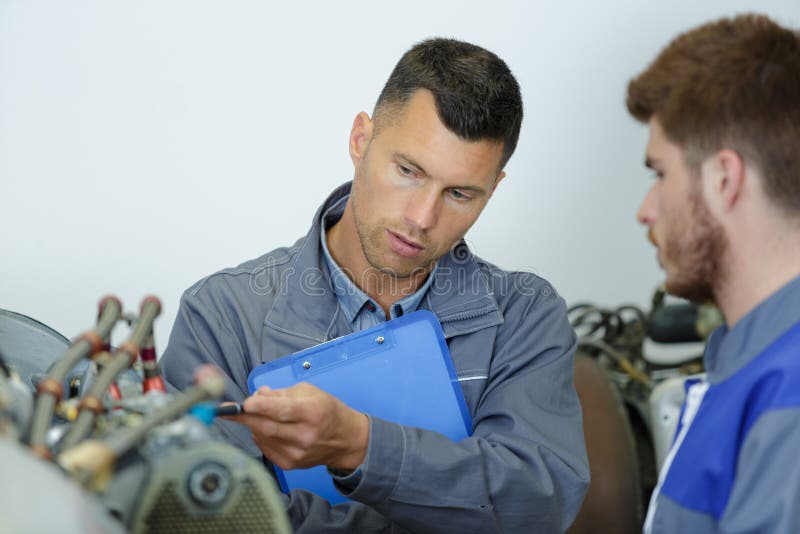Two Men Looking for Engine Failure Stock Photo - Image of checkup ...
