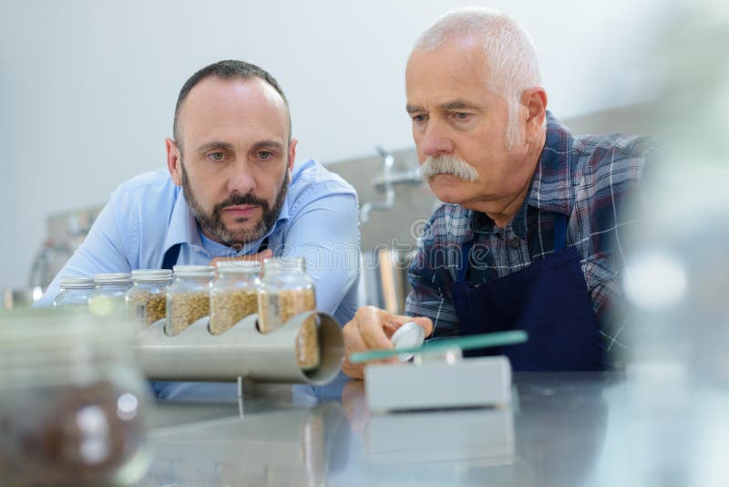 Two Men Looking at Samples in Quality Control Laboratory Stock Image ...