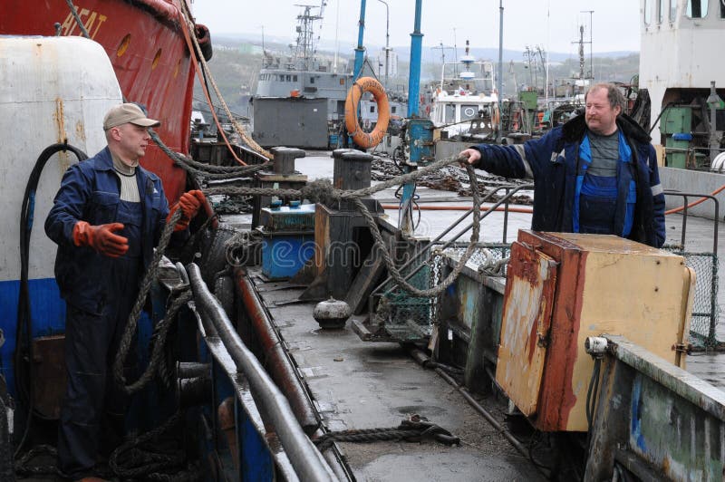 Two Men Moored Ship at a Pier Editorial Photography - Image of mooring ...