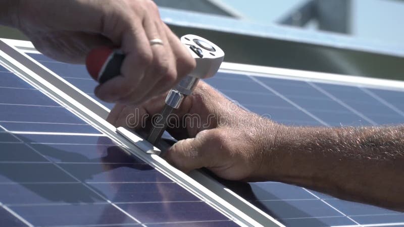 Two Men are Mounting a Solar Panel with a Wrench, Alternative Energy ...