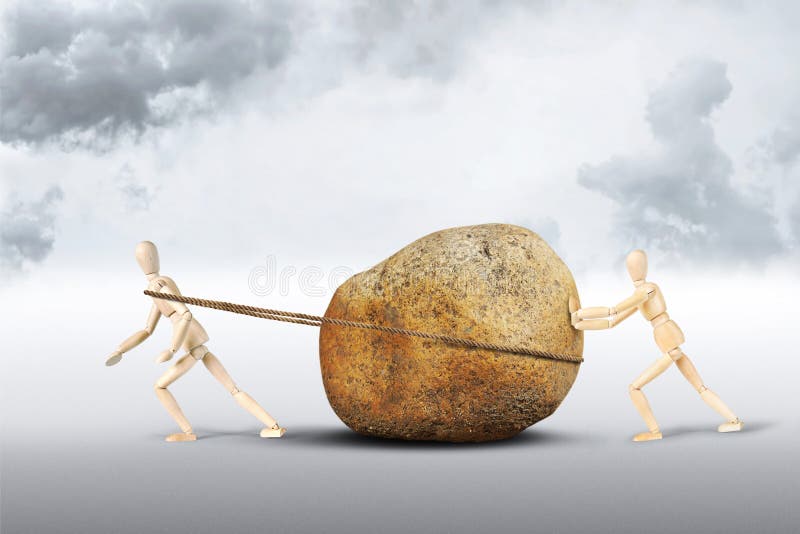 Two men move a huge stone stock photo. Image of cooperate - 73989482